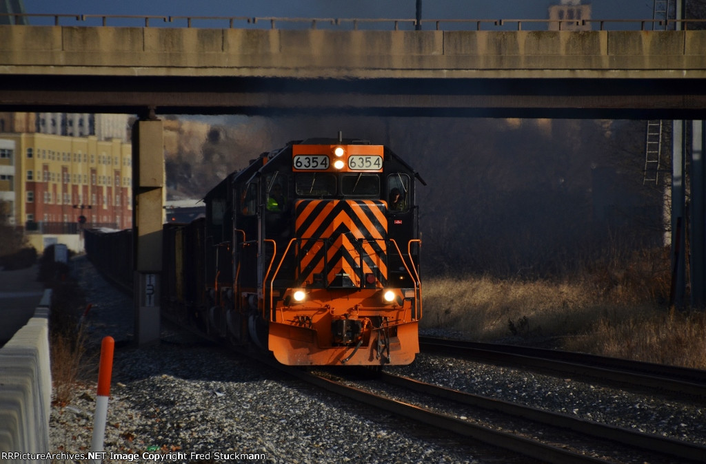 WE 6354 blasts out of downtown.